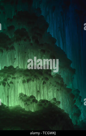 Huge ice icicles. Fragment of large blocks of ice frozen waterfall of ...