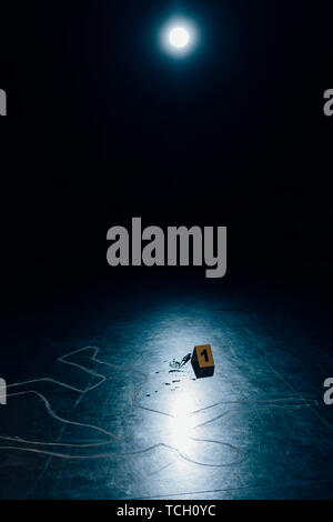 Crime scene with chalk outline, knife and blood marks on floor ...
