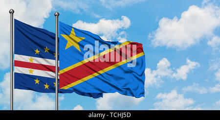 Congo and Cape Verde flag waving in the wind against white cloudy blue ...