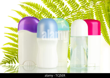 deodorants with green leaf isolated on white Stock Photo - Alamy
