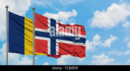 Norway and Chad flag waving in the wind against white cloudy blue sky ...