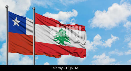 Lebanon and Chile flag waving in the wind against white cloudy blue sky ...