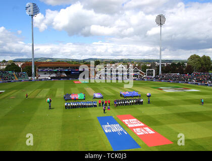 The teams stand for the national anthems during the Rothesay 5th ...