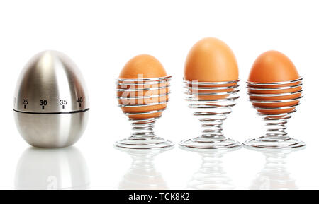 egg timer and egg in metal stand isolated on white Stock Photo - Alamy
