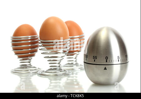 egg timer and egg in metal stand isolated on white Stock Photo - Alamy