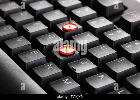 Painful typing, pins on keyboard close-up Stock Photo - Alamy