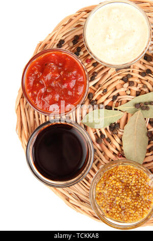 various sauces on wicker mat isolated on white Stock Photo - Alamy