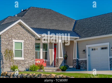 small brick house against blue sky Stock Photo - Alamy