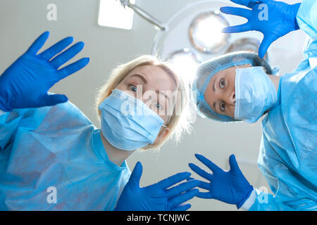 Crazy scary and funny doctors surgeons dentists in masks with gloves ...