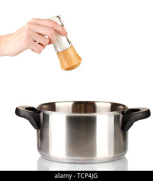 Hand adding salt using salt shaker isolated on white Stock Photo - Alamy