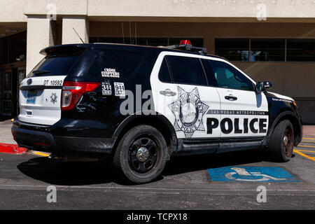 Las Vegas Metropolitan Police officer making a report in his police car ...