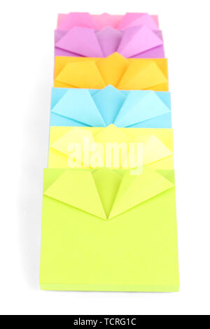 Colorful sticky note stack with a hand holding a roller ball pen , with ...