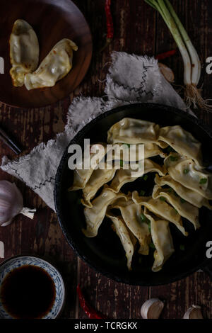 Pot stickers on a pan Stock Photo - Alamy