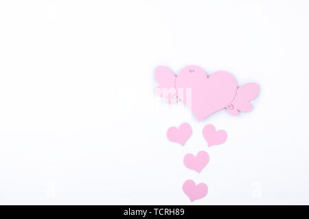 Pink cherubs love heart shape on white background Stock Photo - Alamy