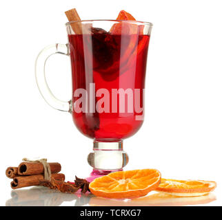 Fragrant mulled wine in glass with spices and oranges around on wooden ...