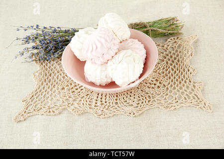 Marshmallows on color plate on light background Stock Photo - Alamy