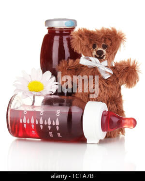 Baby bottle with fresh juice and teddy bear on blue background Stock ...