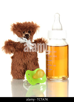 Baby bottle with fresh juice and teddy bear on blue background Stock ...