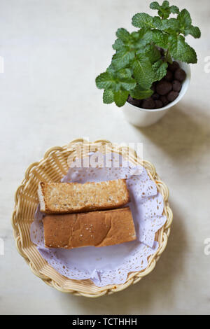 Freshly baked traditional bread and green poting Stock Photo - Alamy