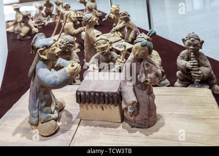 Folk life scene mud sculpture Stock Photo - Alamy
