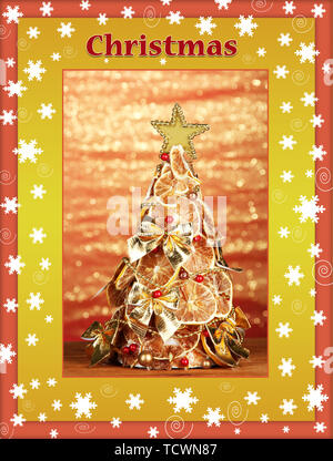 beautiful christmas tree of dry lemons with decor, on shine green ...