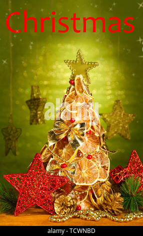 beautiful christmas tree of dry lemons with decor, on shine background ...