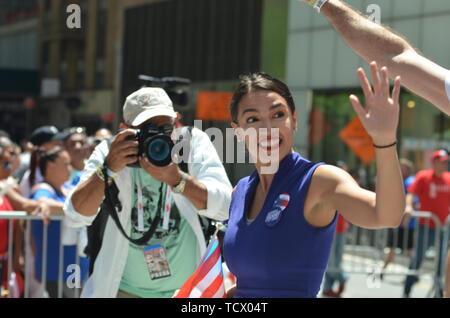 Alexandria Ocasio-Cortez marching in New York City Puerto Rican Day ...