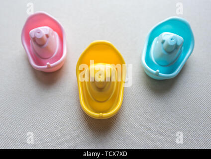 Red, yellow and blue boat toy Stock Photo - Alamy