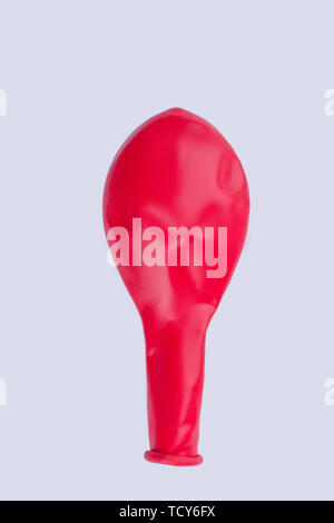 Single deflated decorative red balloon isolated on white background ...
