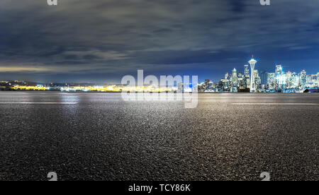 asphalt road with cityscape of seattle at night Stock Photo - Alamy