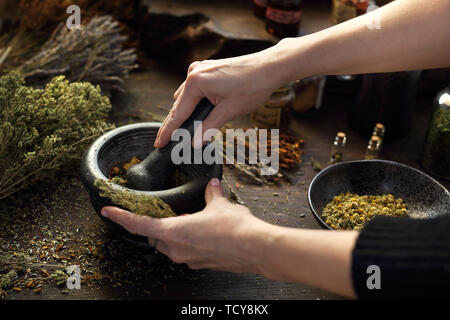An apothecary grinding herbs Stock Photo: 32484194 - Alamy