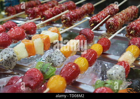 Traditional Chinese food: Sugar-coated haws Stock Photo - Alamy