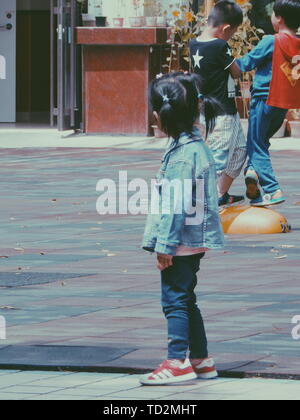 It's evening. Everyone's out for fun Stock Photo - Alamy