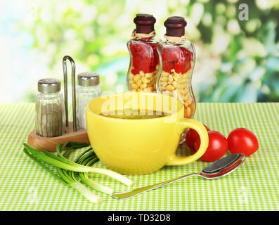 Fragrant soup in cup on table in garden Stock Photo - Alamy