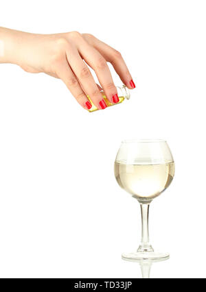 Pour something into glass with drink isolated on white Stock Photo - Alamy