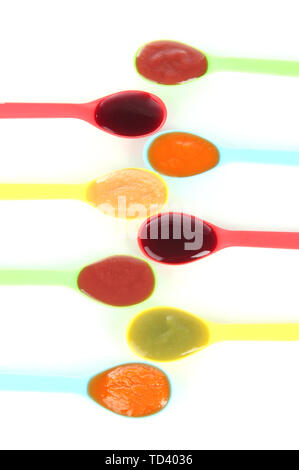 Baby puree in spoons isolated on white Stock Photo - Alamy