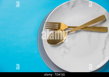 Elegant spoon with napkin isolated on white Stock Photo - Alamy