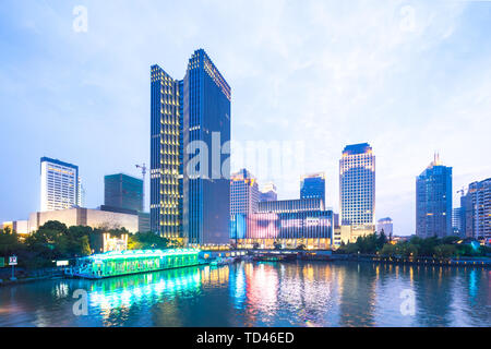 modern office buildings near water at twilight Stock Photo - Alamy