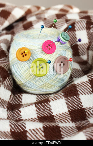 Ball of thread in the buttons Stock Photo - Alamy
