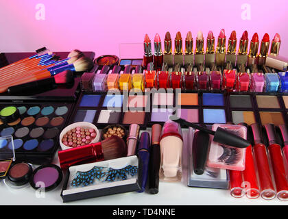 Lot of different cosmetics on pink background Stock Photo - Alamy