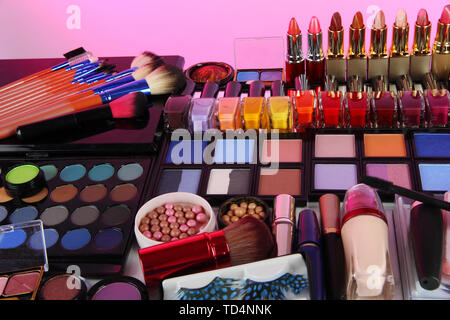 Lot of different cosmetics on pink background Stock Photo - Alamy