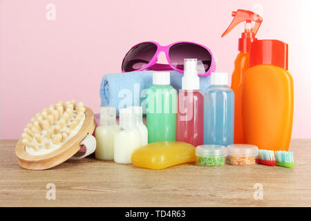 Hotel amenities kit on table on pink background Stock Photo - Alamy