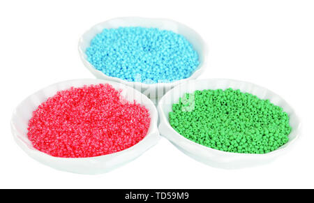 Colorful beads in plates isolated on white Stock Photo - Alamy