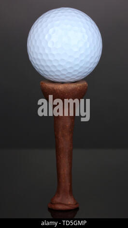 Golf ball on grey background Stock Photo - Alamy