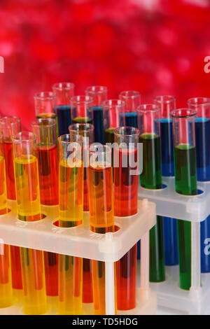 Colorful test tubes on bright background Stock Photo - Alamy