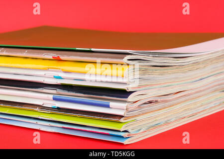 Many magazines on red background Stock Photo - Alamy