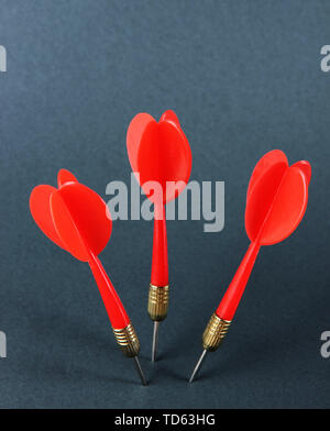Darts on gray background Stock Photo - Alamy