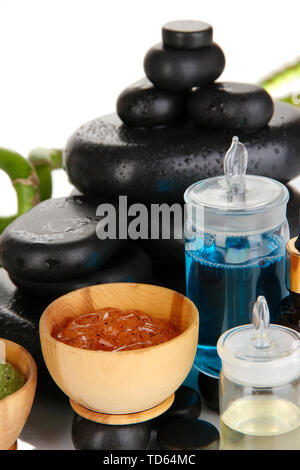 Spas composition with oils and spa stones isolated on white Stock Photo ...