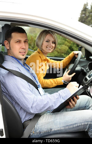 learner driver student driving car with instructor Stock Photo - Alamy