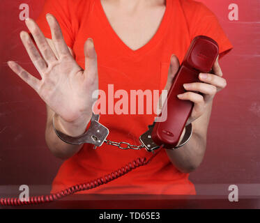 Prisoner in handcuffs behind glass in soundproof room Stock Photo - Alamy